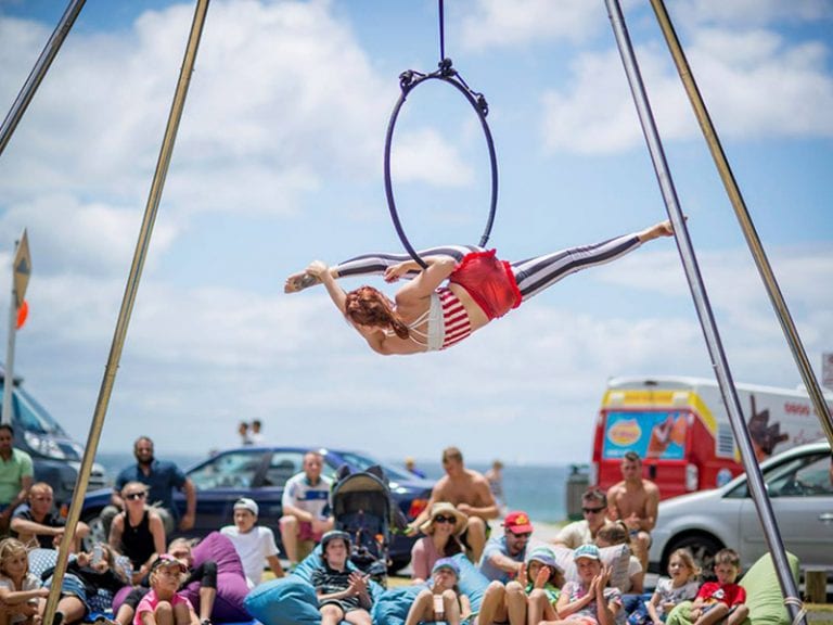 Performing aerial hoop on rig outdoor event - Circus In A Flash